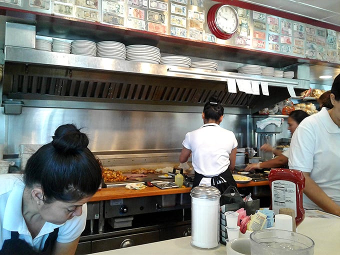 The choreography of the open kitchen reveals the ballet behind your breakfast – line cooks performing short-order magic amid sizzling symphonies.