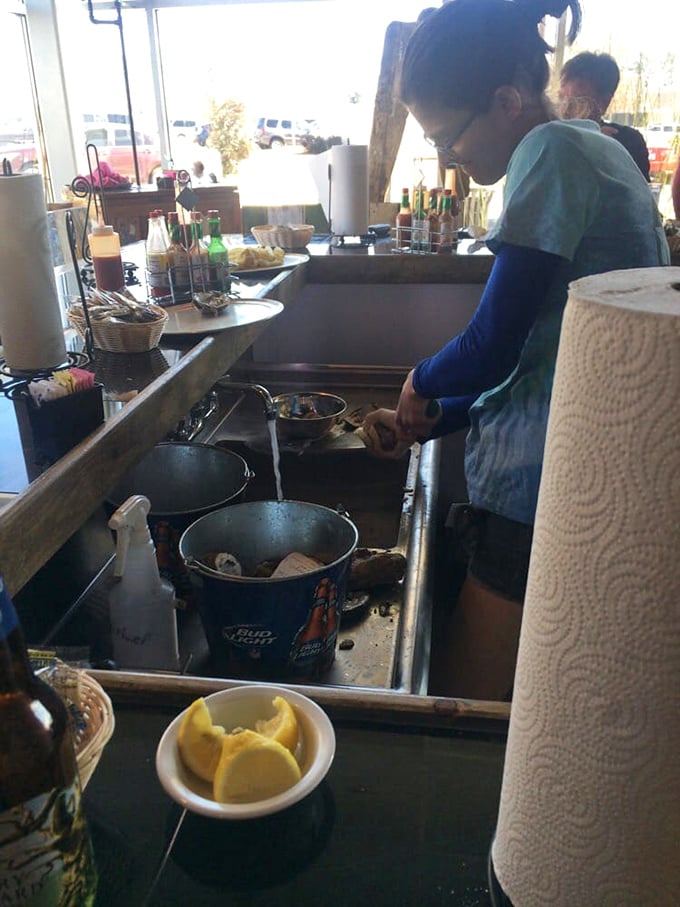 Where seafood magic happens—skilled hands transforming simple ingredients into dishes worth driving across town for.