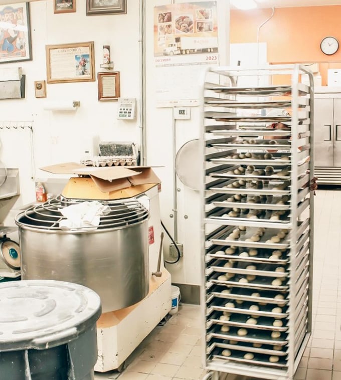 Behind the scenes where the magic happens—racks of dough waiting to become memories for lucky customers.
