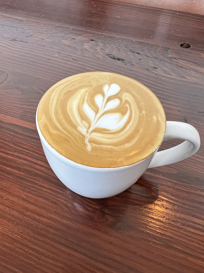 Latte art so pretty you almost don't want to drink it. Almost. That leaf design is practically begging for its Instagram moment.