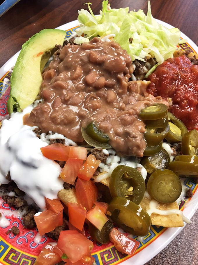 Nachos elevated from snack to main event—a topographical map of flavor with peaks of beans, valleys of cheese, and a landscape worth exploring.