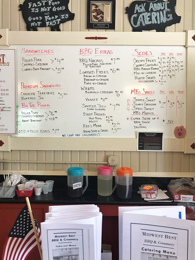 The whiteboard menu isn't just functional—it's a treasure map where X marks the spot for BBQ nachos, loaded fries, and smoked meat salvation.