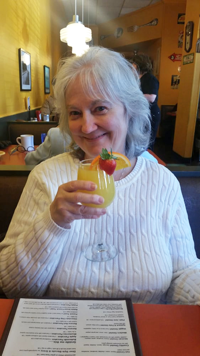 The diner's mimosa comes garnished with fresh fruit – because sometimes breakfast calls for a little celebration in a glass.