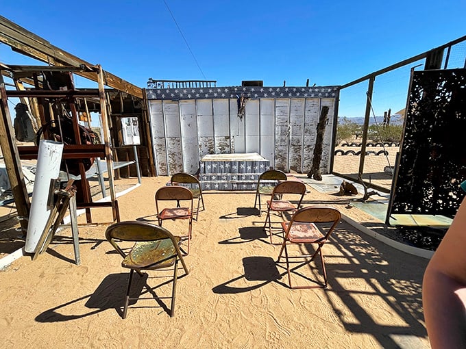 The world's most honest theater—no walls to hide behind, just a handful of mismatched chairs facing life's unscripted performance under the open sky.