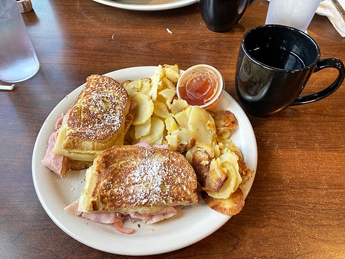 The Monte Cristo: where breakfast and lunch stop fighting and become best friends. Powdered sugar on ham should be weird but somehow isn't.