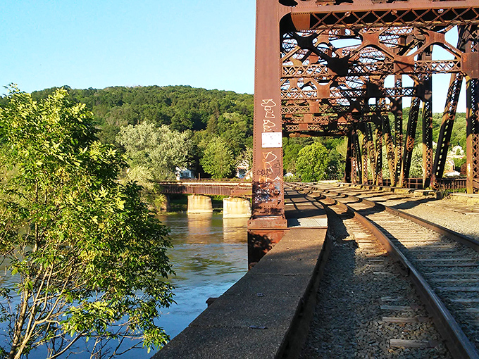 The railroad bridge stands as both historical monument and Instagram-worthy backdrop, connecting Oil City's industrial past with its scenic present.