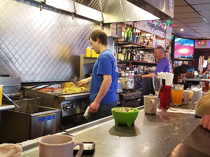 The open kitchen isn't for show—it's where everyday miracles happen at a pace that would make cooking competition shows look leisurely.