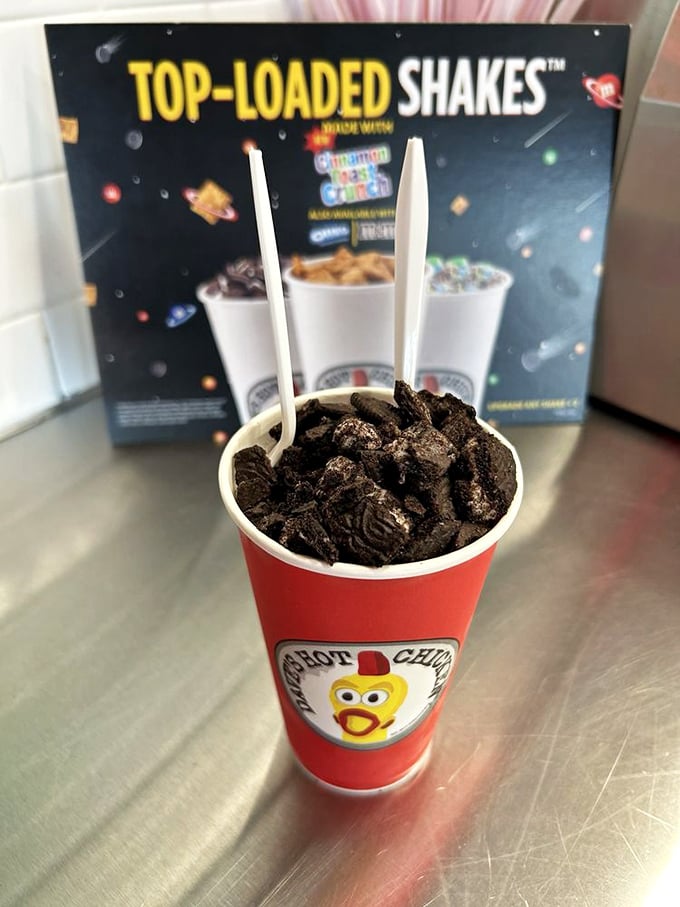 This isn't just a milkshake—it's strategic planning. Nothing combats chicken-induced heat like a mountain of Oreos in cold, creamy dairy.