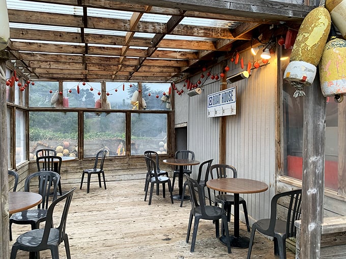 The weathered wooden deck offers views as fresh as the seafood—a rustic dining experience where coastal breezes enhance every bite.