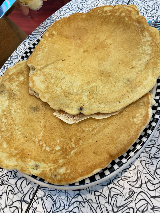 Pancakes the size of vinyl records and just as classic—golden, fluffy, and ready for their close-up on your breakfast table.