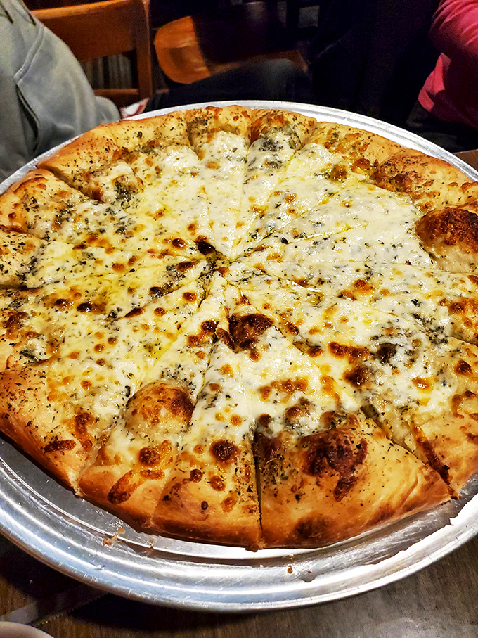 Pizza that reminds you why simple is often best—a perfect cheese-to-sauce ratio on a crust that strikes the ideal balance between chewy and crisp.