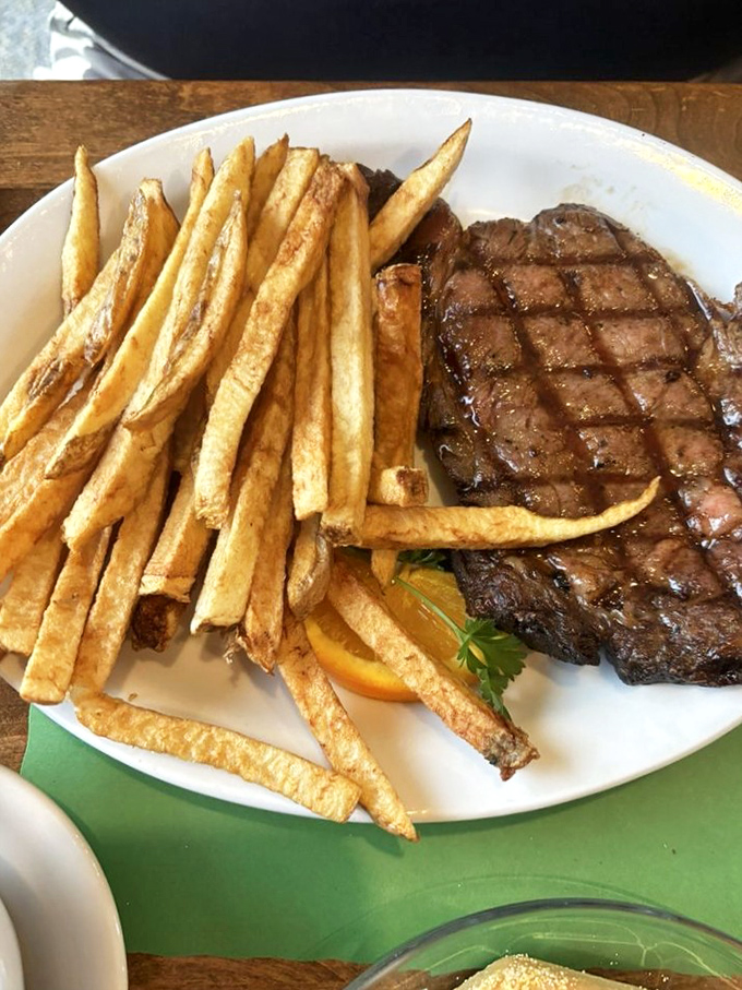 This steak isn't just grilled—it's been given a philosophy about life, complete with perfect diamond grill marks and golden fries.