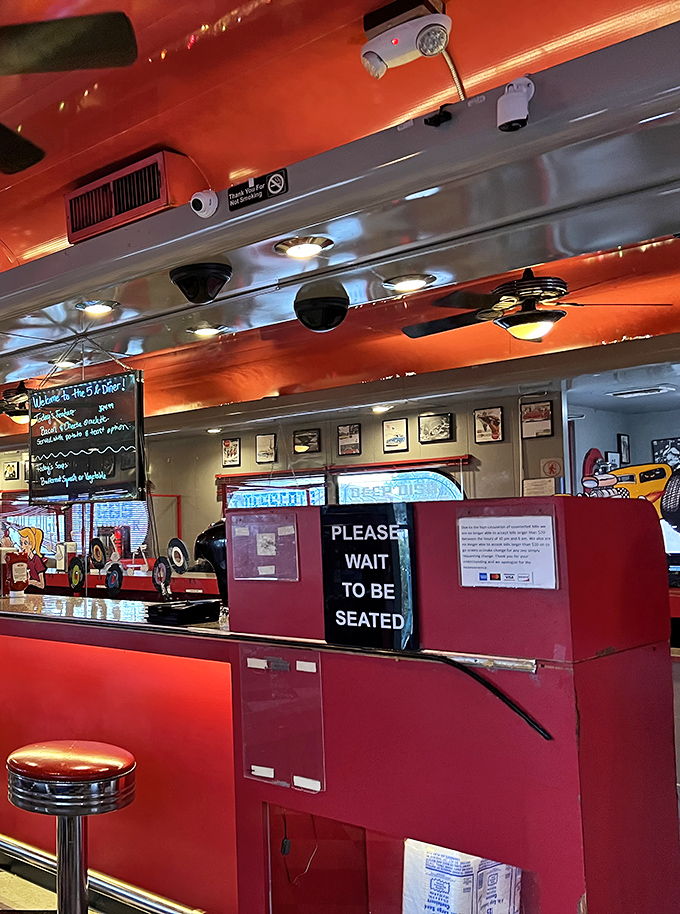 Classic diner hospitality starts at the host station where friendly service meets retro charm and efficiency.