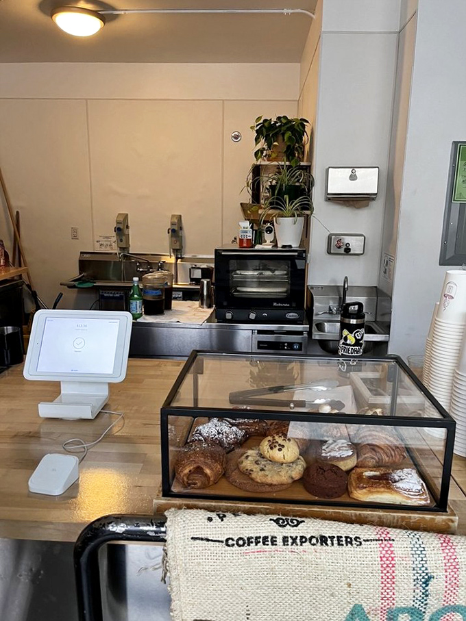 The pastry case—that glass box of temptation—showcases croissants and cookies that make nutritional resolutions crumble faster than the pastries themselves.