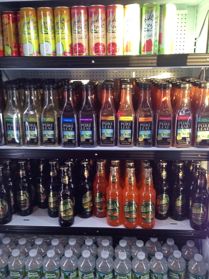 The beverage selection rivals a small-town reunion—something for everyone, from sweet tea enthusiasts to craft soda aficionados.