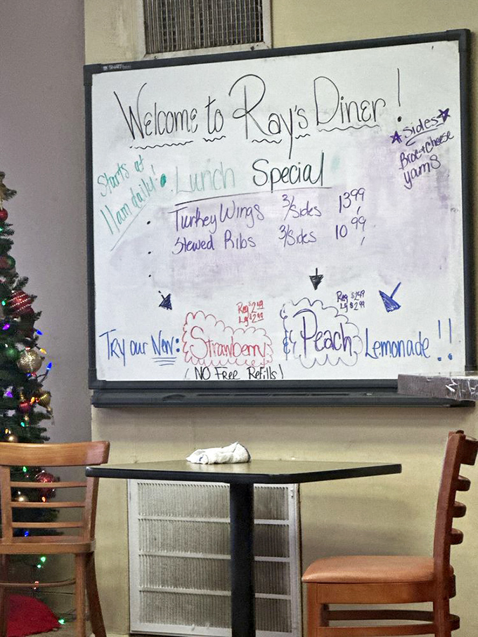 The whiteboard of daily specials—a handwritten promise that today's meal will be different from yesterday's. Those turkey wings aren't messing around.