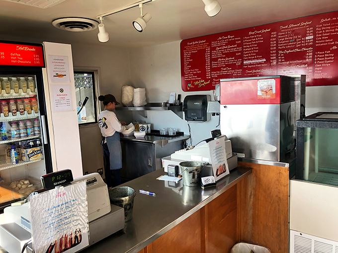 Where the magic happens—kitchen staff focused on the serious business of making sure your seafood is cooked just right.