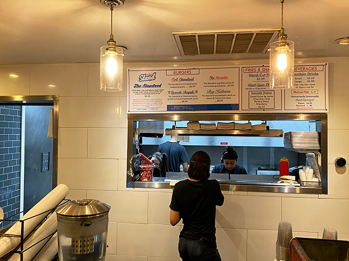 A glimpse into the kitchen where burger magic happens—no smoke and mirrors, just dedicated folks turning simple ingredients into edible joy.