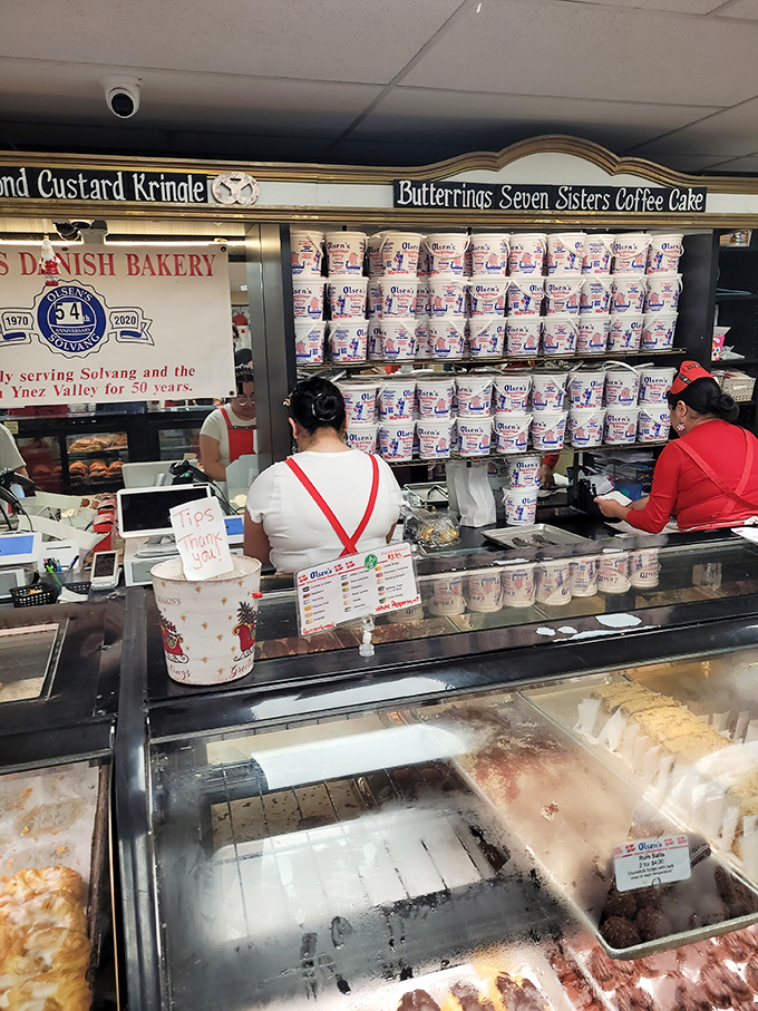 Behind the counter, the real magic happens. These aren't just bakers—they're happiness engineers working with flour, butter, and generations of Danish know-how.