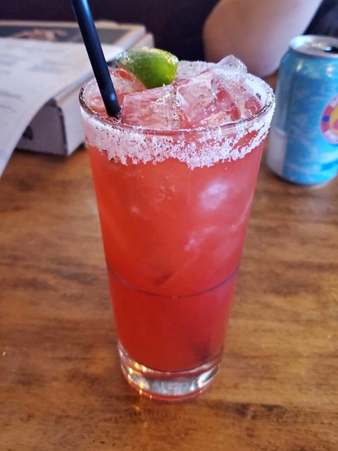 That strawberry drink with its sugar-rimmed glass isn't just refreshing—it's what summer would look like if it took liquid form.