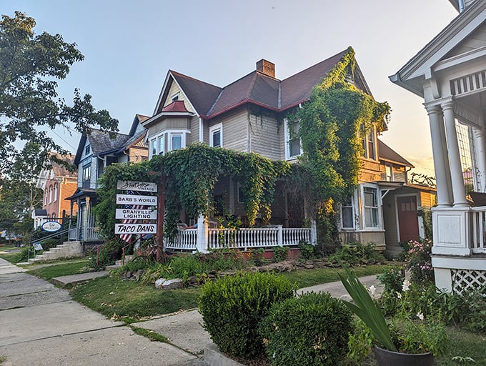 Victorian charm wrapped in climbing vines—this house has more character than most Netflix series and better curb appeal too.
