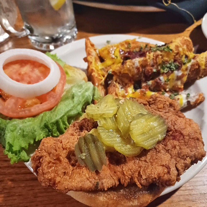 A tenderloin sandwich with loaded fries that proves sometimes the best steak experience doesn't require a knife and fork at all.