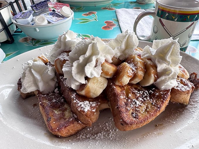 French toast that's dressed for success with bananas, whipped cream, and a dusting of powdered sugar. Breakfast or dessert? Yes, please.