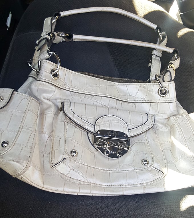 That's not just any white handbag—that's the designer accessory someone paid hundreds for that could be yours for pocket change.