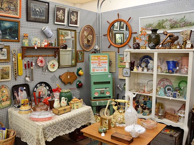 Grandma's china cabinet exploded in the best possible way, scattering treasures from jadeite dishware to nautical-themed mirrors across this charming booth.