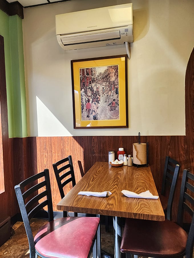 The counter area—where regulars perch on red vinyl stools, watching the breakfast ballet unfold as orders fly and coffee flows in an endless stream. 