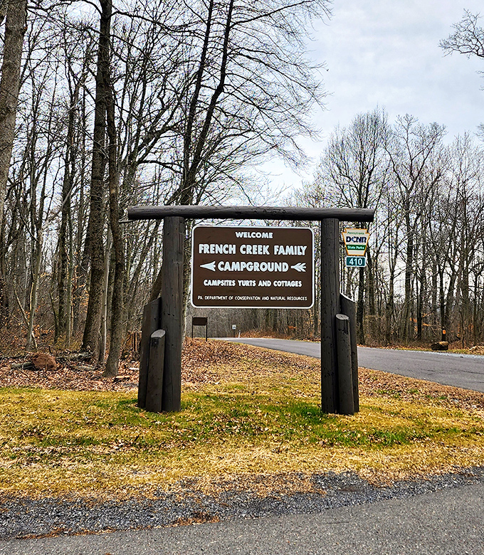 The entrance sign promises adventure while simultaneously reminding you that yes, you do need to follow campground rules. Civilization's last gasp.