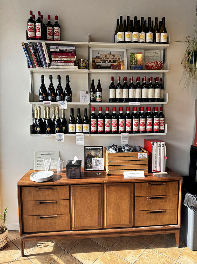 A wine selection that means business. These bottles aren't just decoration—they're carefully chosen companions for your pizza journey.