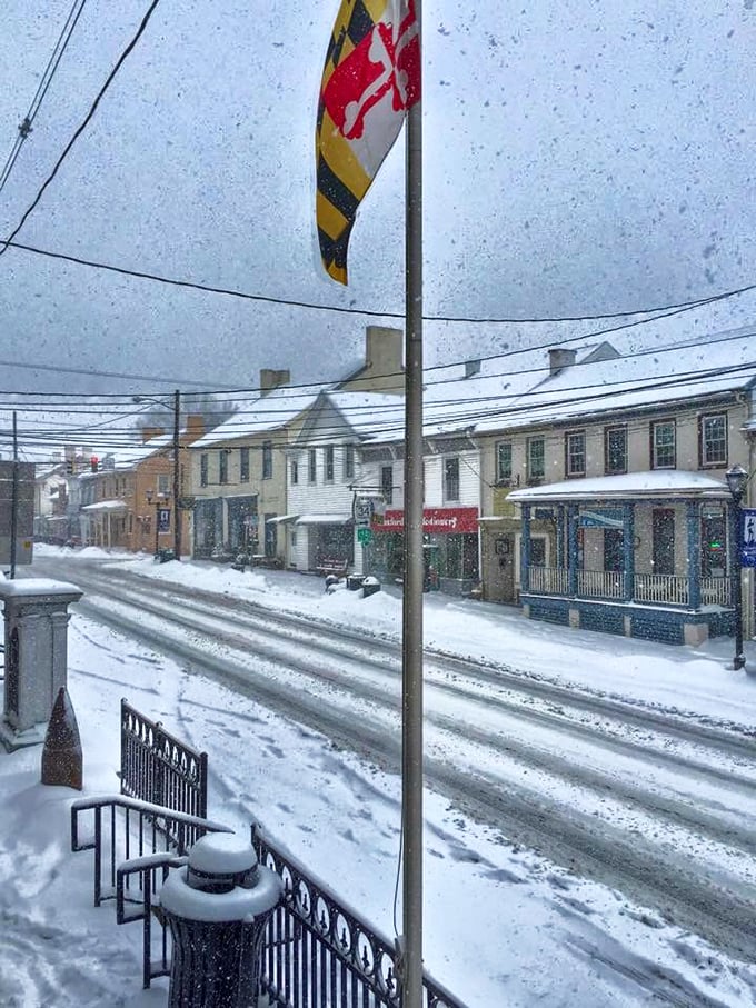 Winter transforms Boonsboro into a Currier and Ives print come to life – where Maryland's state flag stands proud against the pristine snowfall.