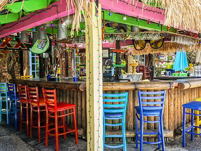 The outdoor bar bursts with color like a piñata exploded and turned into furniture—exactly where you want to sip something cold on a hot day.
