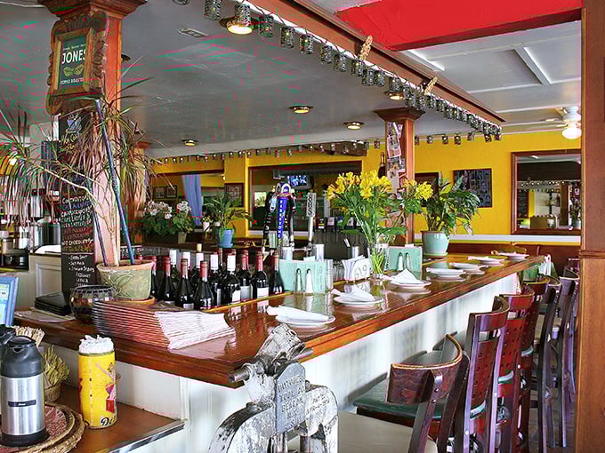 The bar area: where wine bottles stand at attention, ready to complement your deep dish adventure with appropriate grape-based enthusiasm.