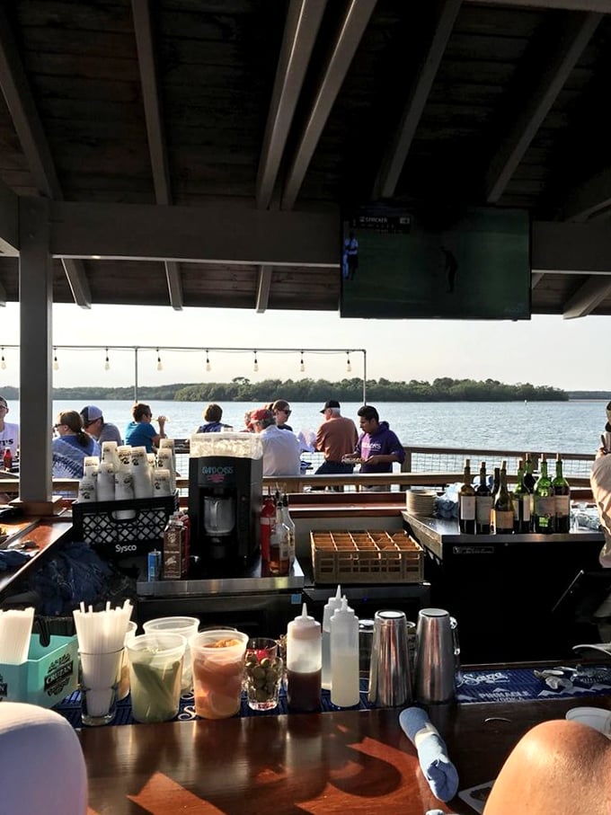 The waterfront bar offers front-row seats to nature's dinner theater—boats coming in with the catch you might be eating tomorrow.