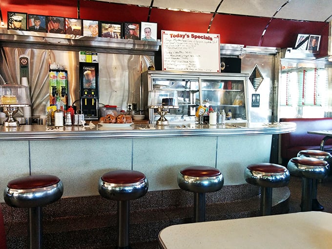 The counter seats—where solo diners become regulars, and regulars become family. Each chrome stool has heard a thousand stories.