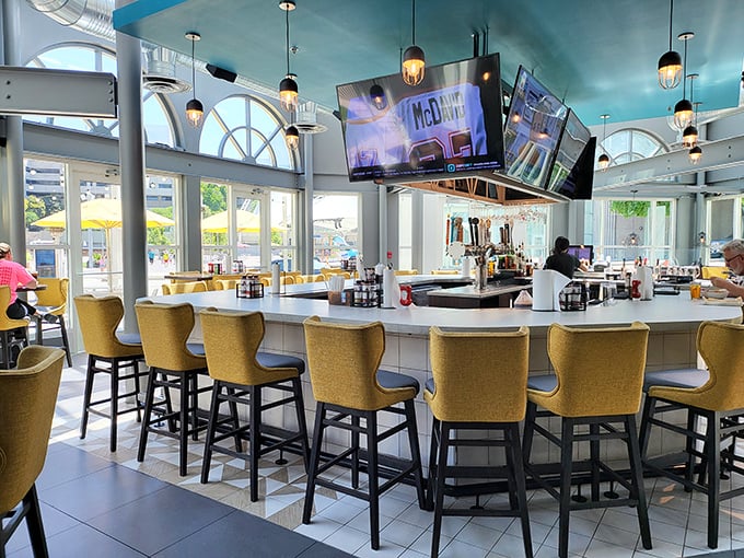 The bar where barbecue dreams come true. Those yellow chairs are like beacons guiding hungry souls to smoky salvation.