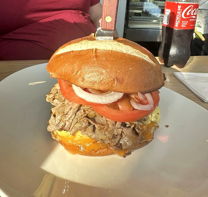 A sandwich so substantial it needs a skewer to hold it together. That's not engineering—that's lunch architecture.