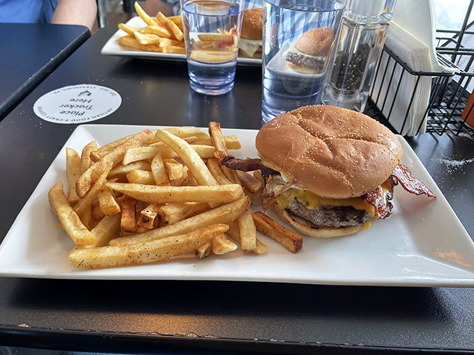 Even lunch gets the royal treatment—a perfectly grilled burger with golden fries that would make a breakfast loyalist consider switching teams.