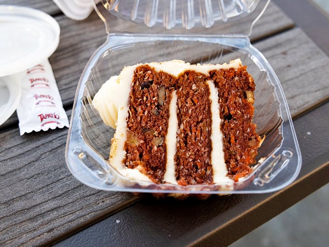 Carrot cake that somehow manages to feel like a virtuous ending to a seafood feast – dense, moist, and sporting cream cheese frosting that doesn't know the meaning of restraint.