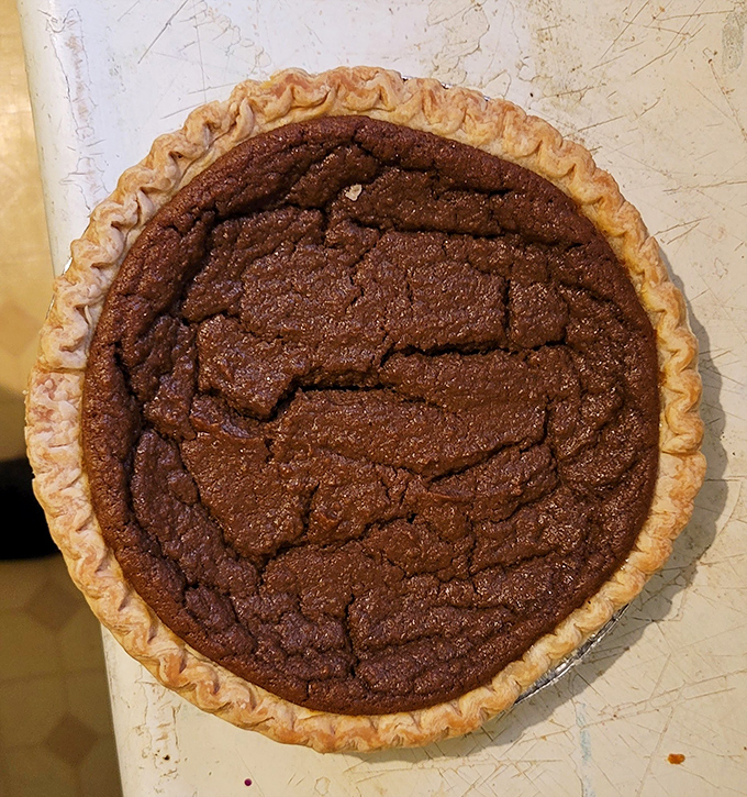 This chocolate chess pie isn't playing games – unless the game is "How fast can you reach dessert nirvana?" Spoiler alert: very fast.