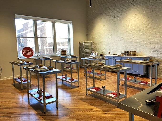 The candy-making classroom stands ready for aspiring chocolatiers, with stainless steel workstations gleaming under the promise of sugary creativity.