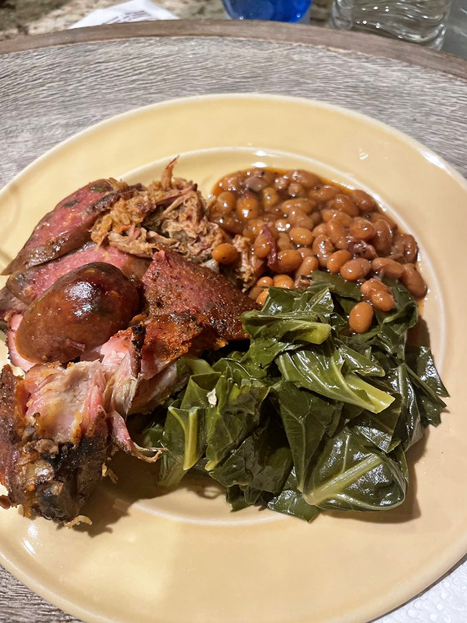 Southern comfort on a plate, where collard greens, beans, and meat create the ultimate comfort food trifecta.