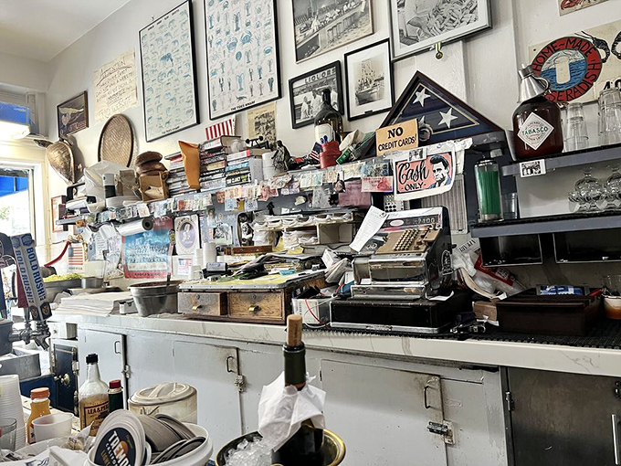 That vintage cash register isn't retro chic—it's authentic, just like everything else in this temple of seafood worship.