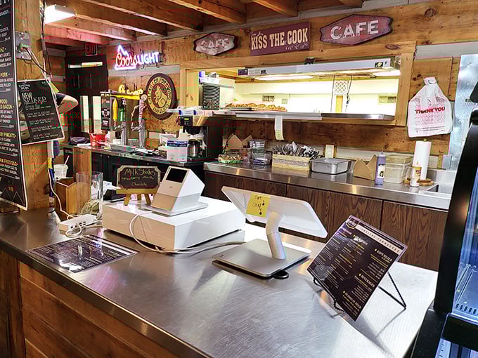 The "Kiss the Cook" sign isn't just cute decor—it's solid advice after you taste what comes from this kitchen.