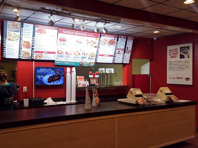 The ordering counter – where dreams of pasta begin and the anticipation builds as you clutch your number, scanning for an available red chair.