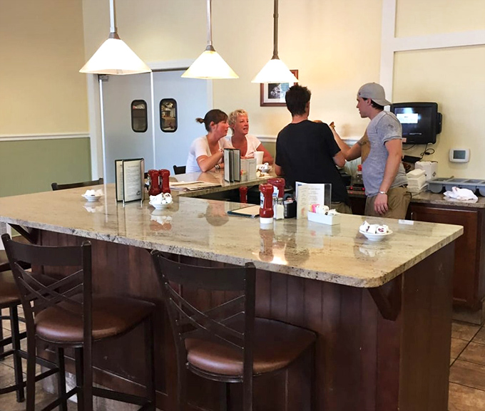 The counter serves as command central, where friendly staff orchestrate the ballet of comfort food that keeps locals and travelers coming back.