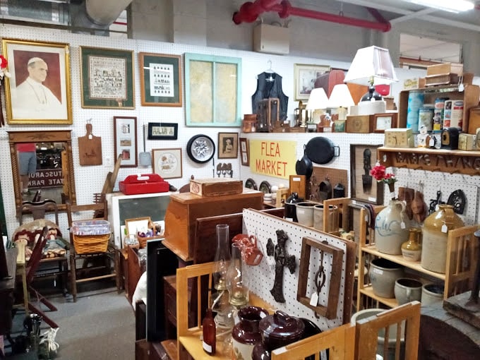 Framed artwork surrounds an eclectic collection of vintage treasures – proof that one person's "what were they thinking?" is another's "I need that!"