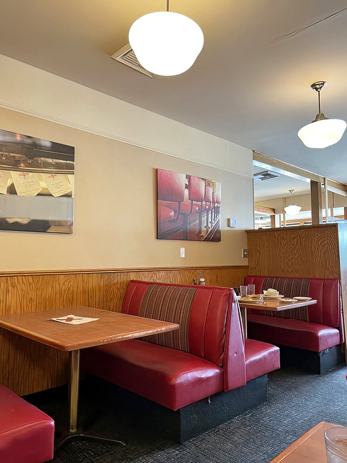 Booths designed for comfort, not Instagram aesthetics—where conversations flow as easily as the coffee.